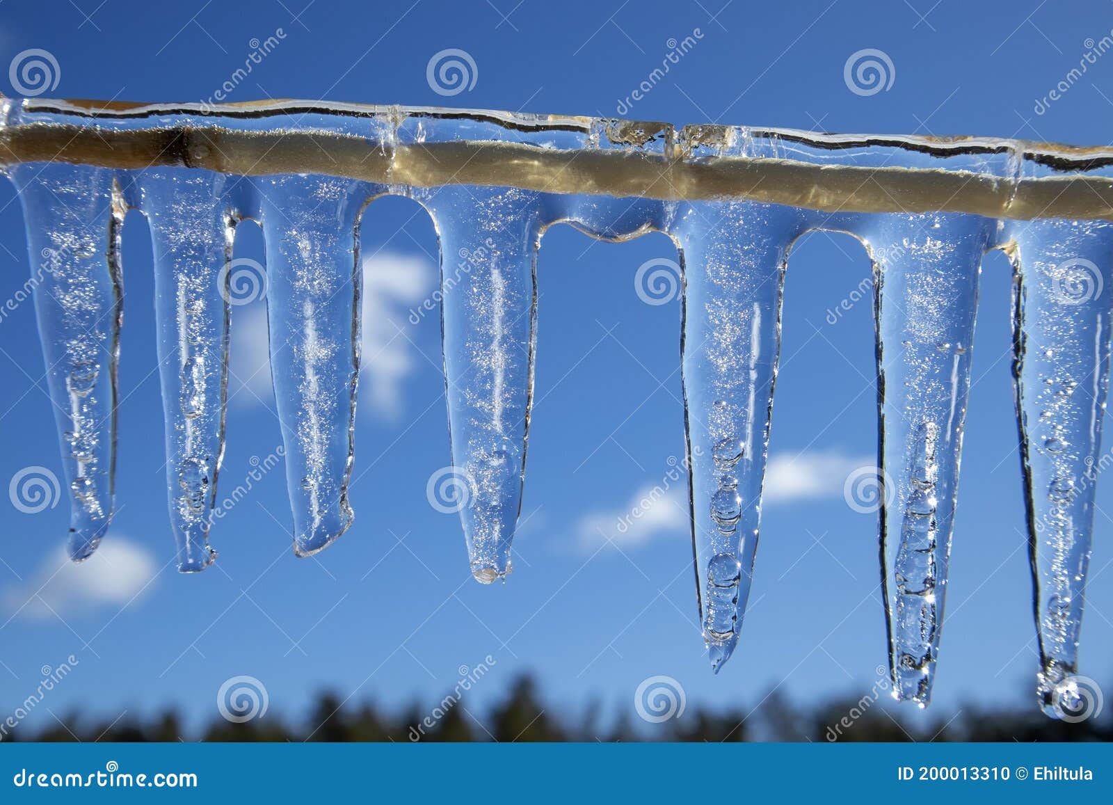 Clear Icicles Against Blue Sky Stock Photo - Image of dripping, frozen ...