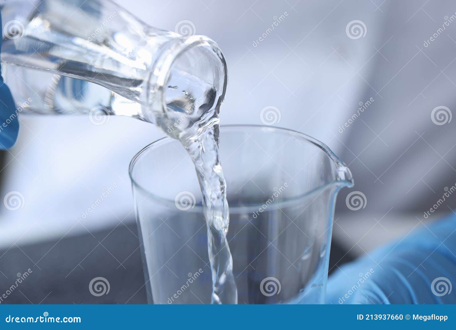 Clear Liquid is Poured from Glass Bottle Stock Photo - Image of liquid ...