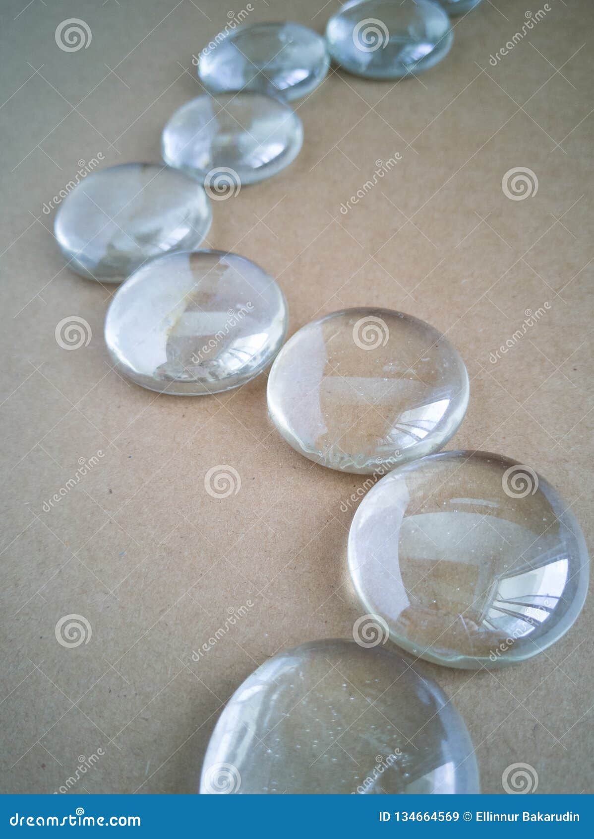 Clear Marbles with Light Reflections on a Brown Background. Stock Image ...
