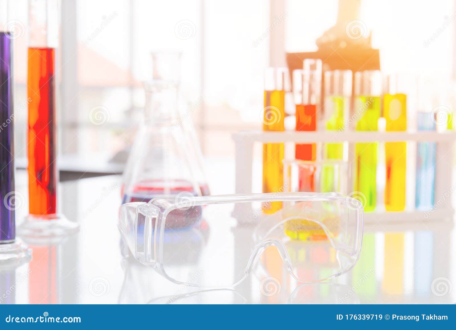 Clear Plastic Glasses, Test Tubes in a Stand and a Microscope on a ...