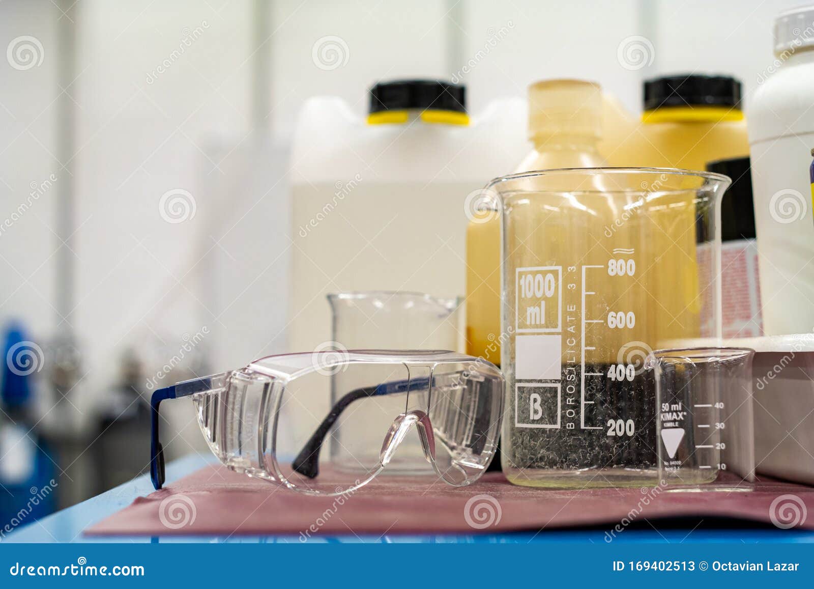 Clear Plastic Protection Goggles Next To Empty Glass and Plastic ...