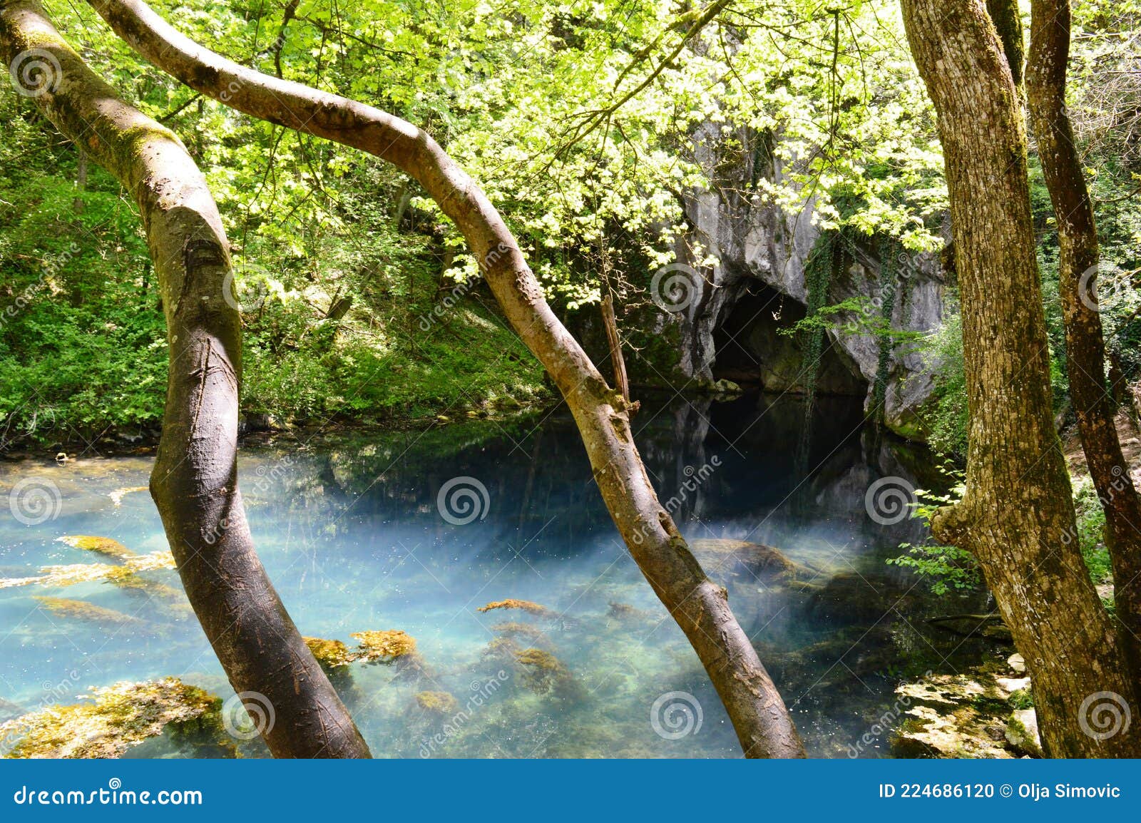 Clear River Emerges From A Small Cave Royalty-Free Stock Image ...