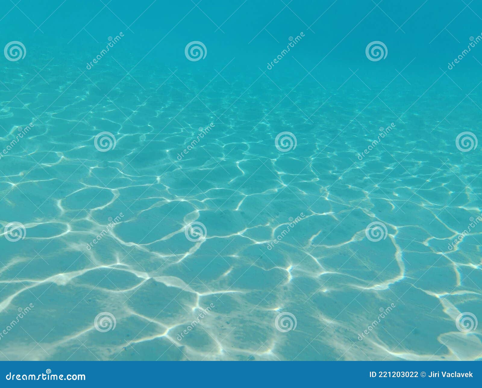 Clear sand under sea water stock photo. Image of texture - 221203022