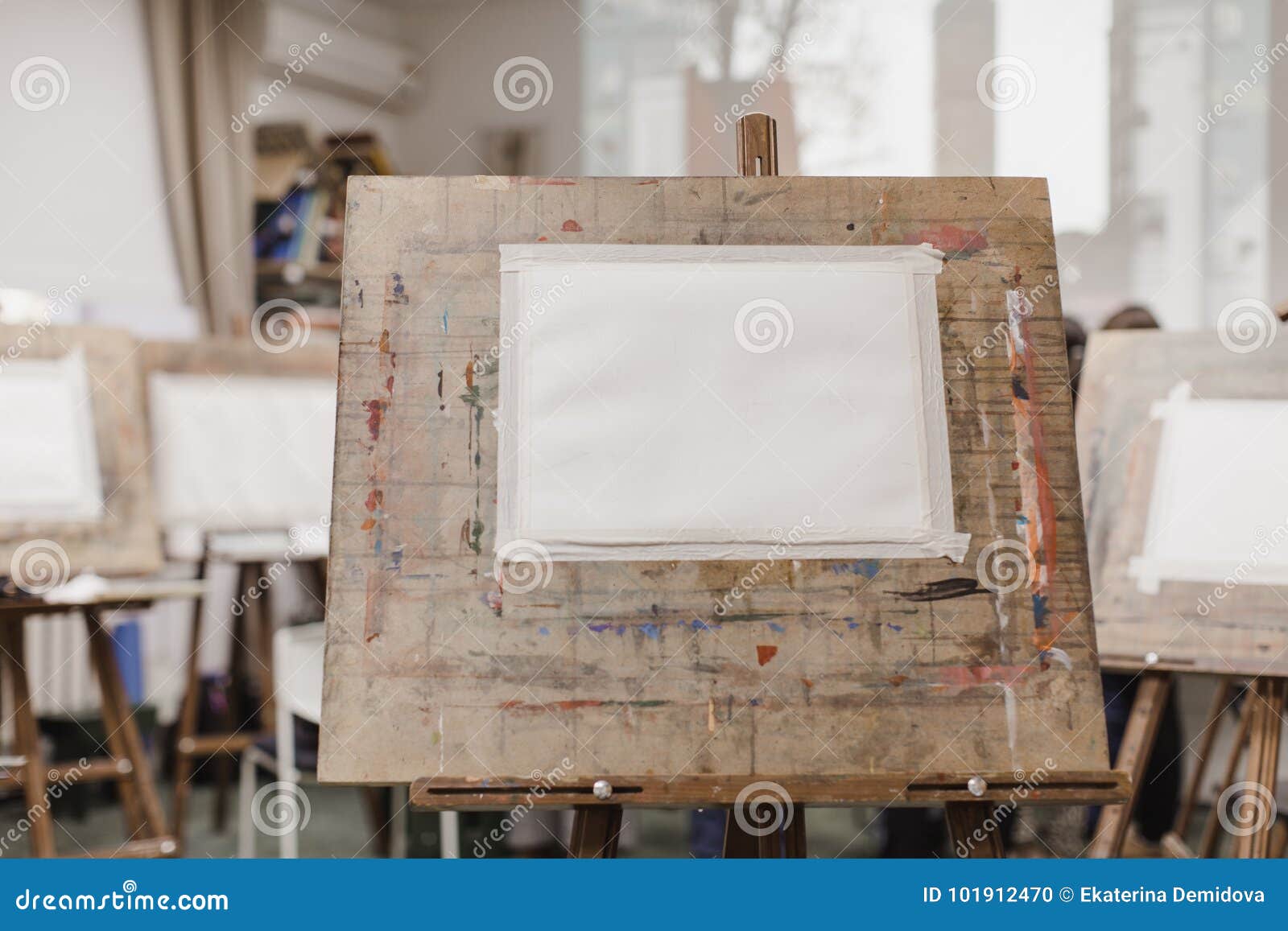Sheet of paper on easel stock photo. Image of class - 101912470