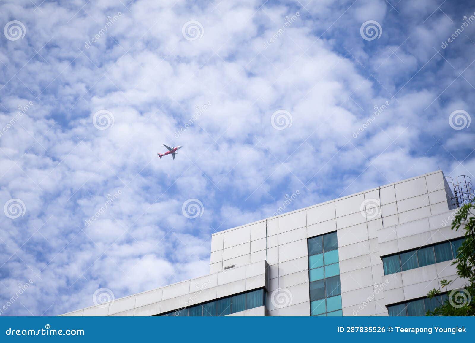 The Clear Sky Saw the Plane Above the Building Stock Photo - Image of ...
