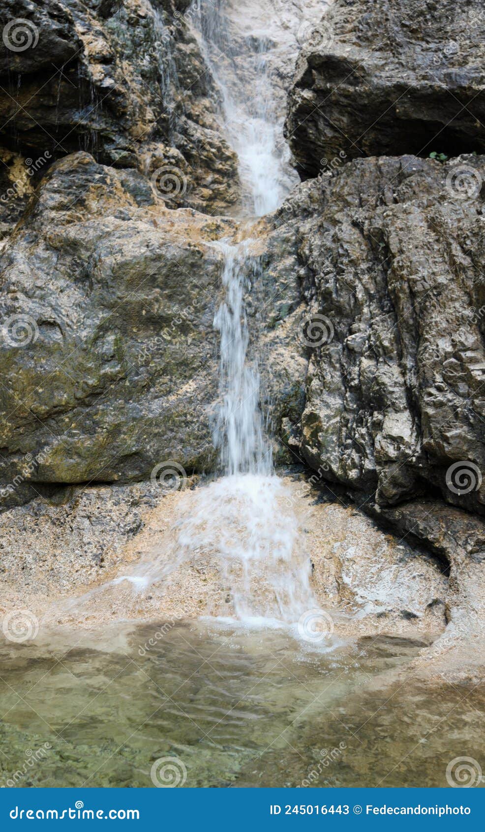 Spring Water that Flows from the Rock Forming a Waterfall Stock Image ...