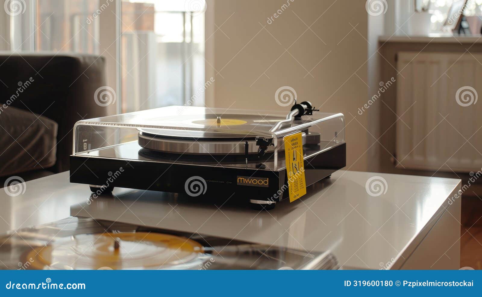 A Clear Vinyl Player with a Black Plastic Frame Was Placed on Top ...