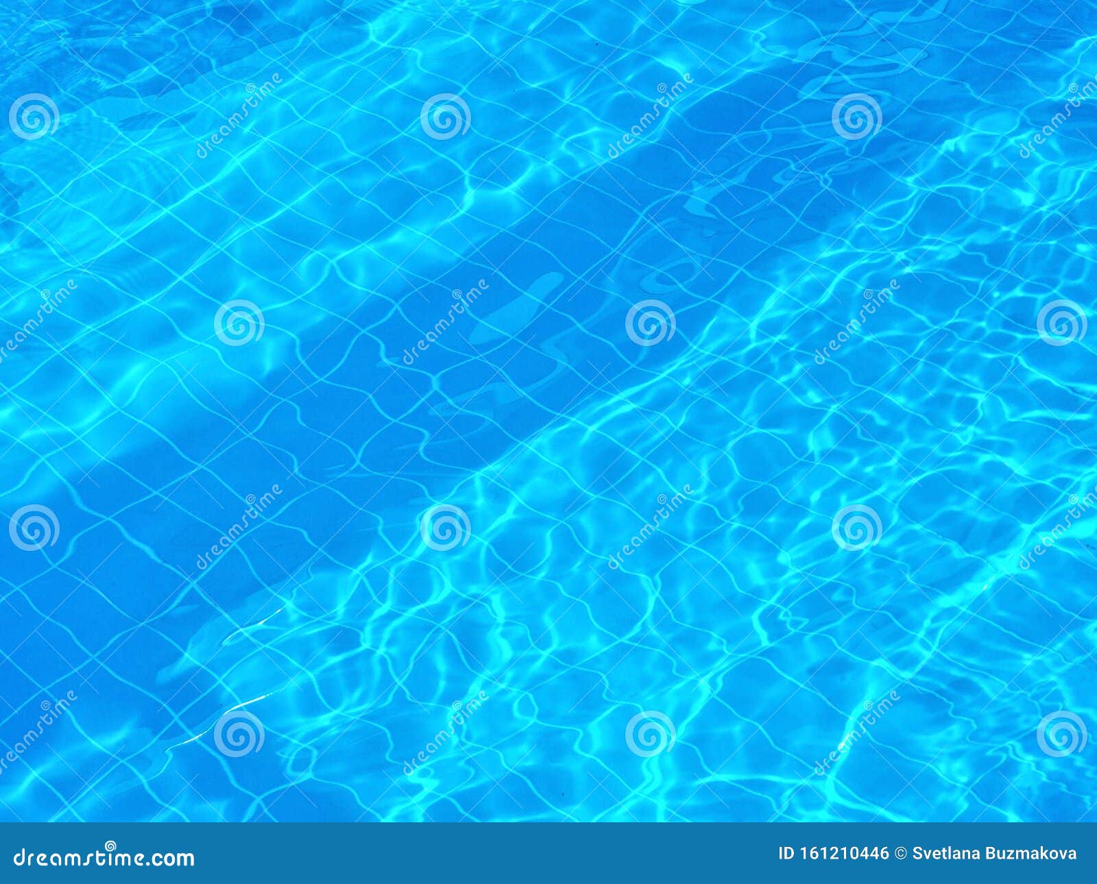 Through the Clear Water, the Checkered Bottom of the Pool is Visible ...