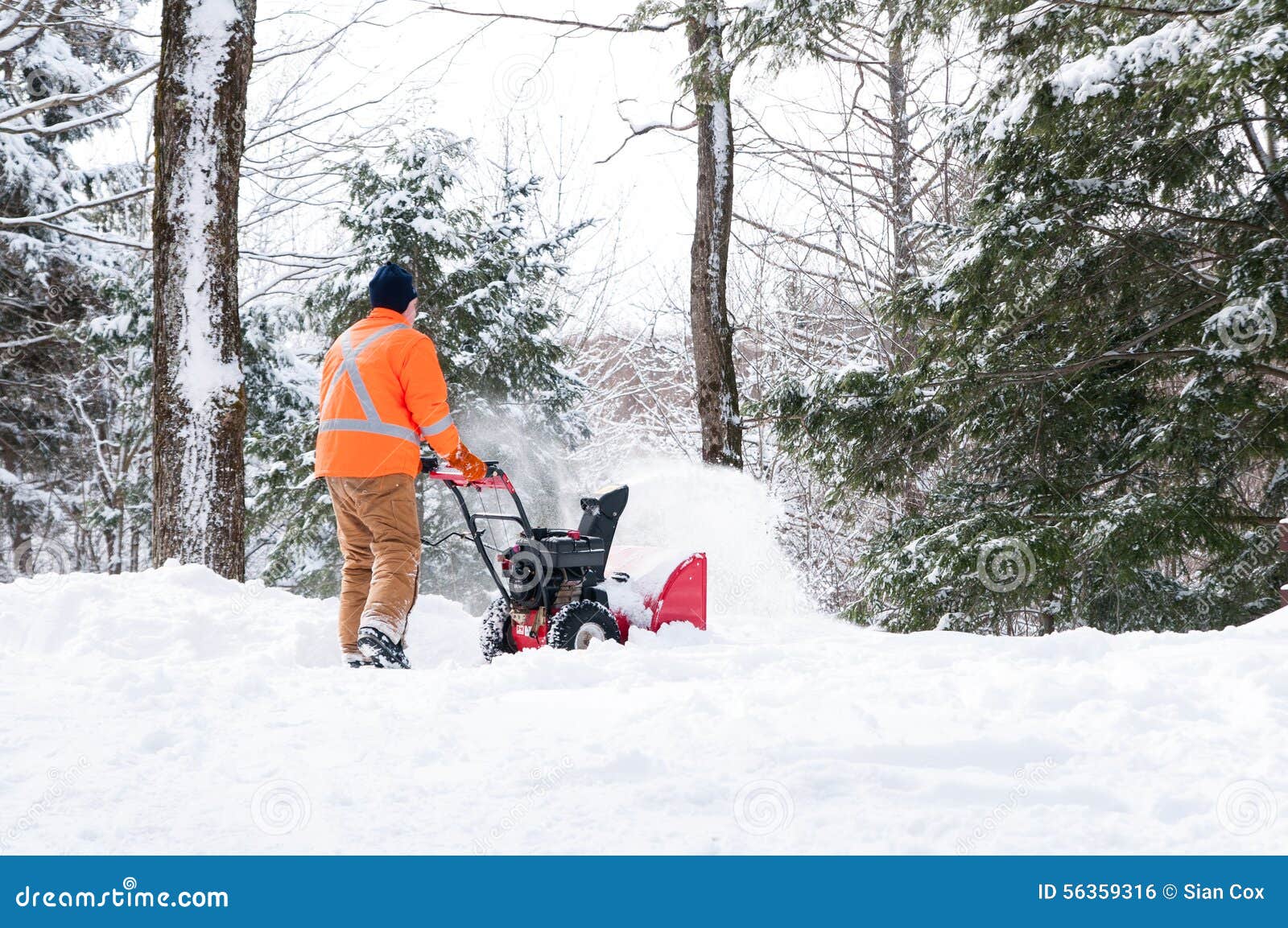 Clearing snow stock photo. Image of cold, snowblower - 56359316