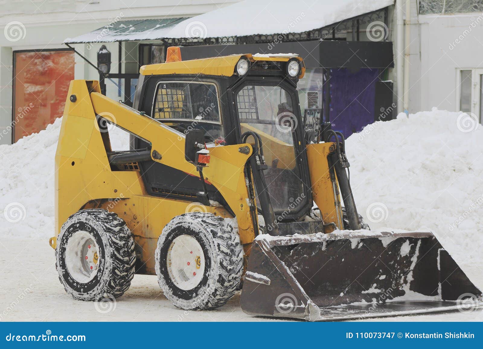 Clearing Snow from the Road with Bulldozer in the City in Winter Stock ... Clearing Snow from the Road with Bulldozer in the City in Winter Stock ...