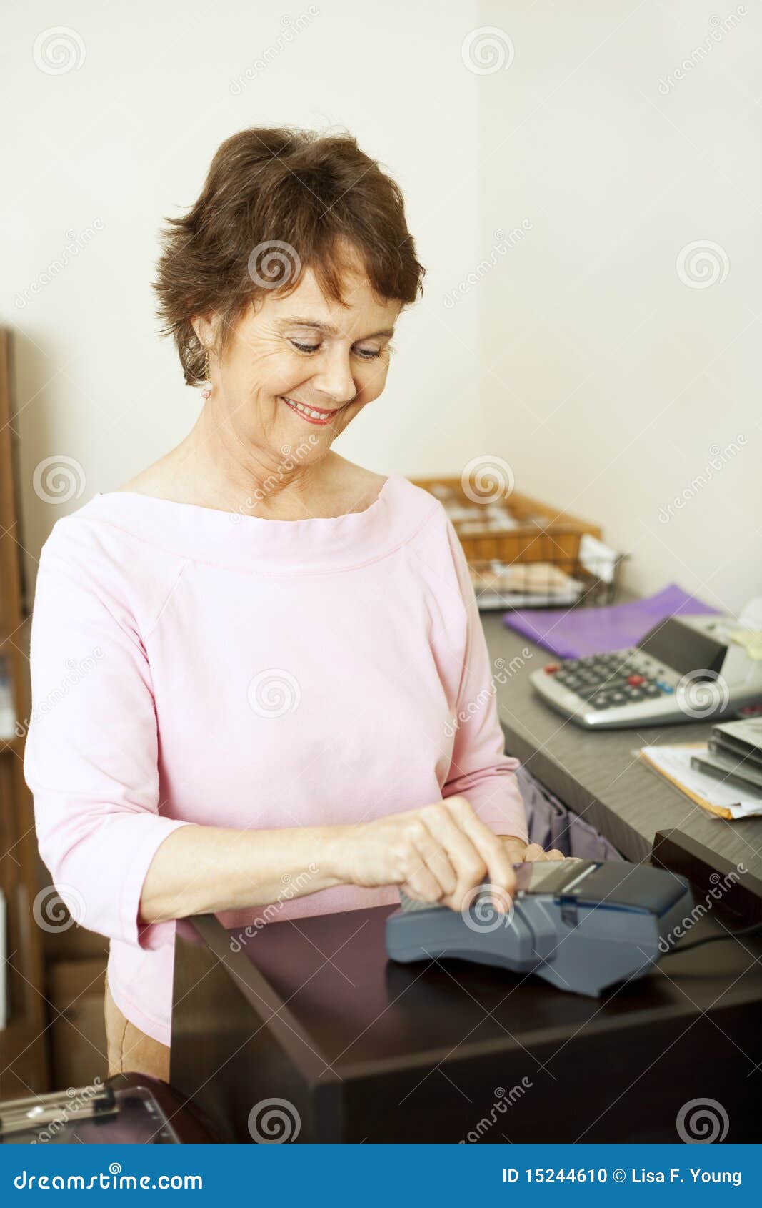Clerk at Credit Card Terminal Stock Photo - Image of debit, owner: 15244610