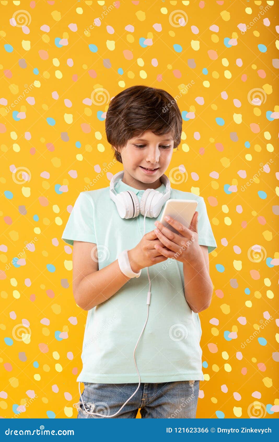Clever Boy Feeling Interested while Using a New Smartphone Stock Photo ...