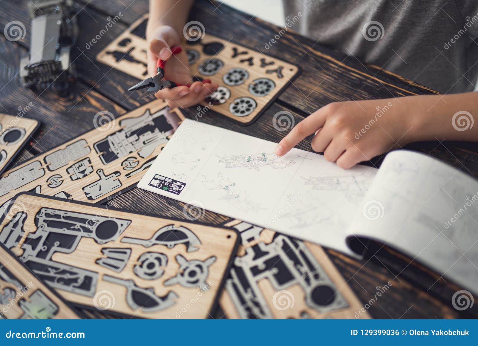 Clever Child Pointing To the Instruction while Sitting with Pliers ...