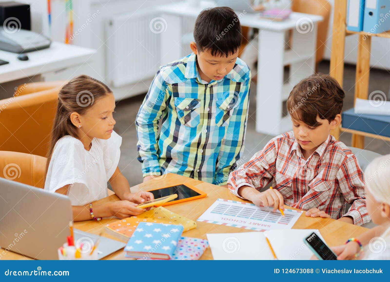 Clever Children Checking an Exercise in a Classroom Stock Photo - Image ...