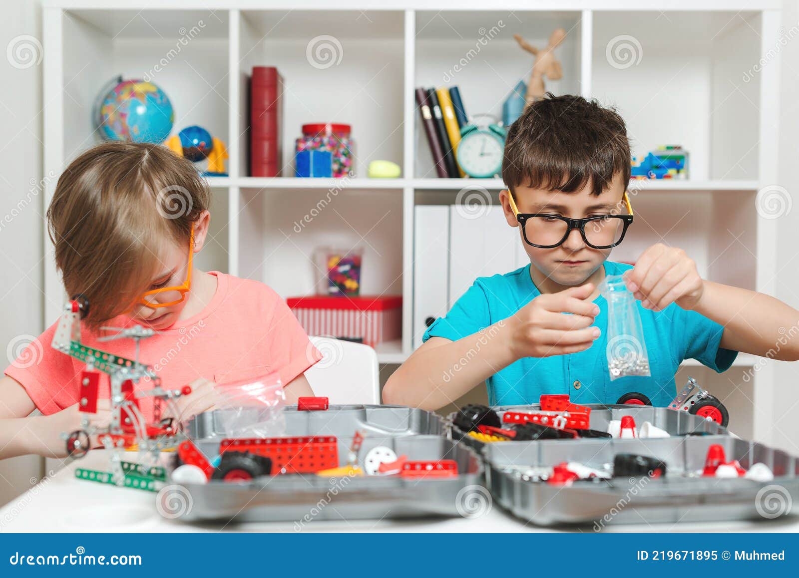 Clever Children Creating Diy Construction At The Table. Happy Boys ...