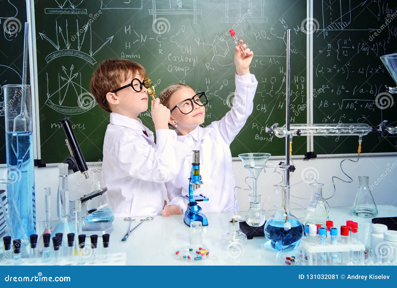 Clever children scientists stock image. Image of analyzing - 131032081
