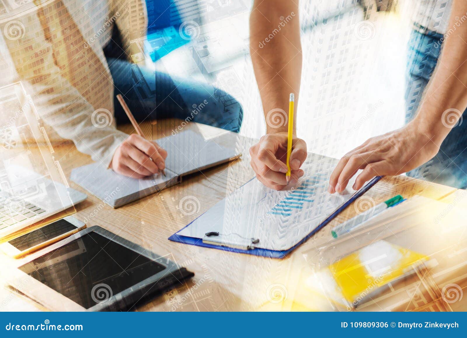 Clever Colleagues Having a Productive Day while Making Notes Stock ...