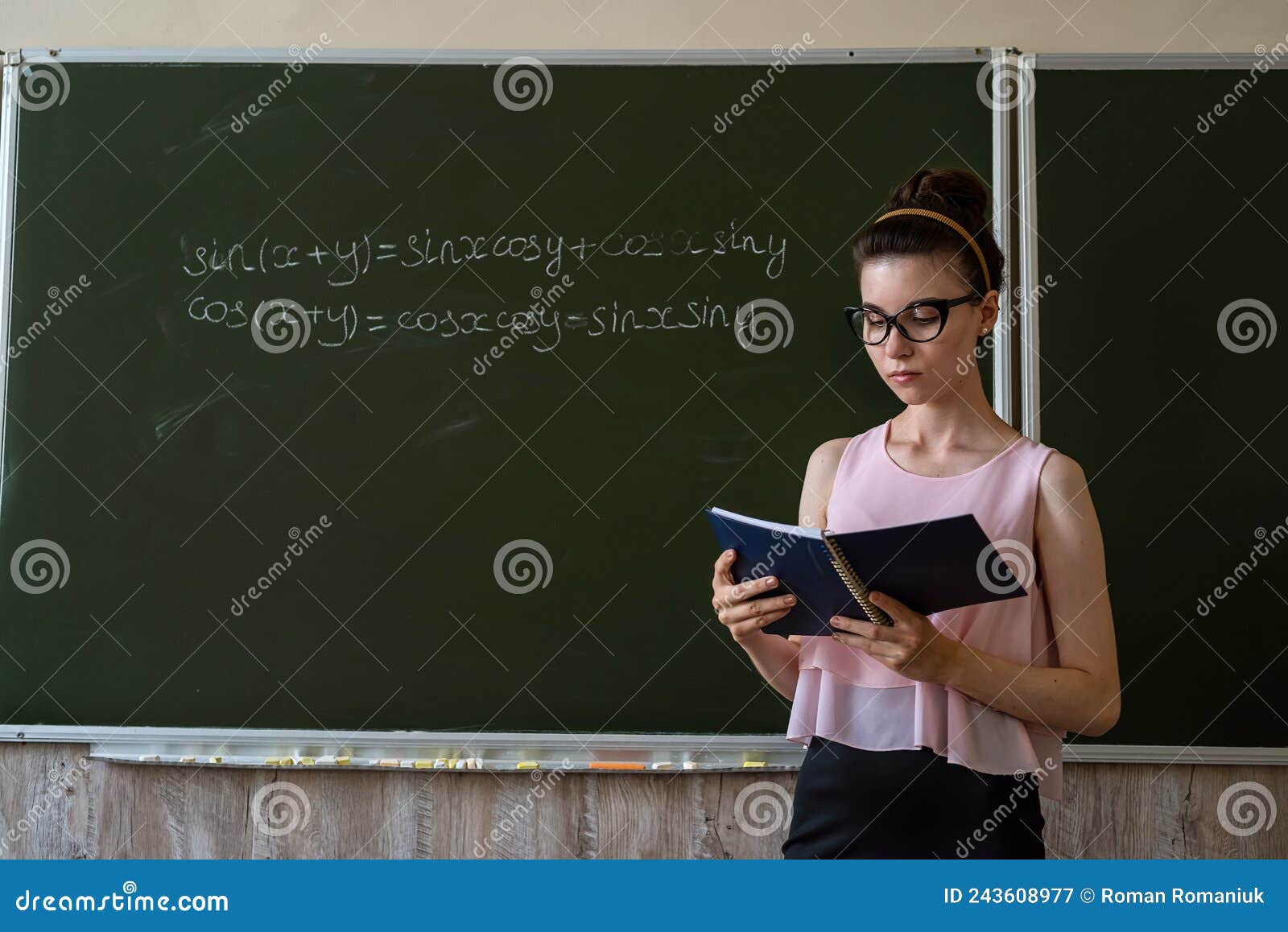 Clever Female Student Writing on a Chalkboard Completing Mathematical ...