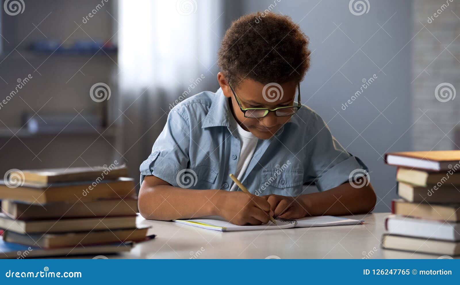 Clever Male Pupil Doing Math Homework, Solving Equation in Notebook ...