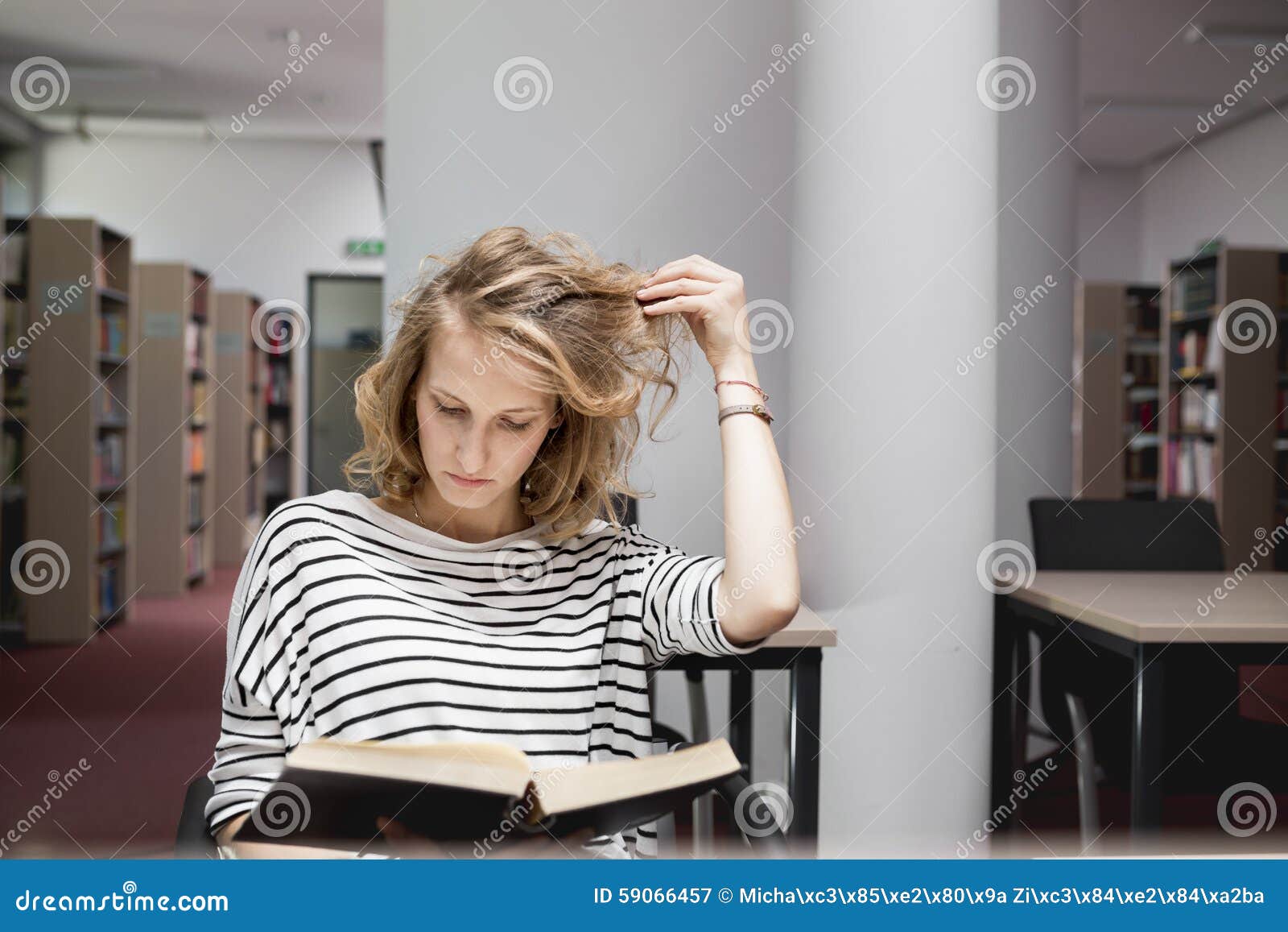Clever Student with Open Book Reading it in College Library Stock Image ...