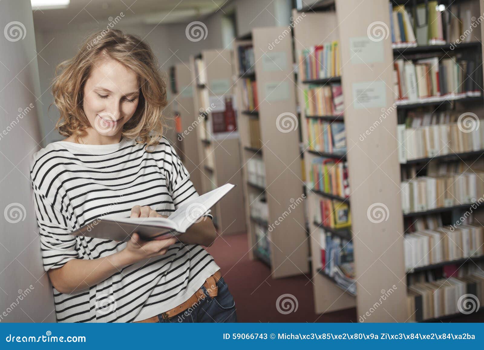 Clever Student with Open Book Reading it in College Library Stock Image ...