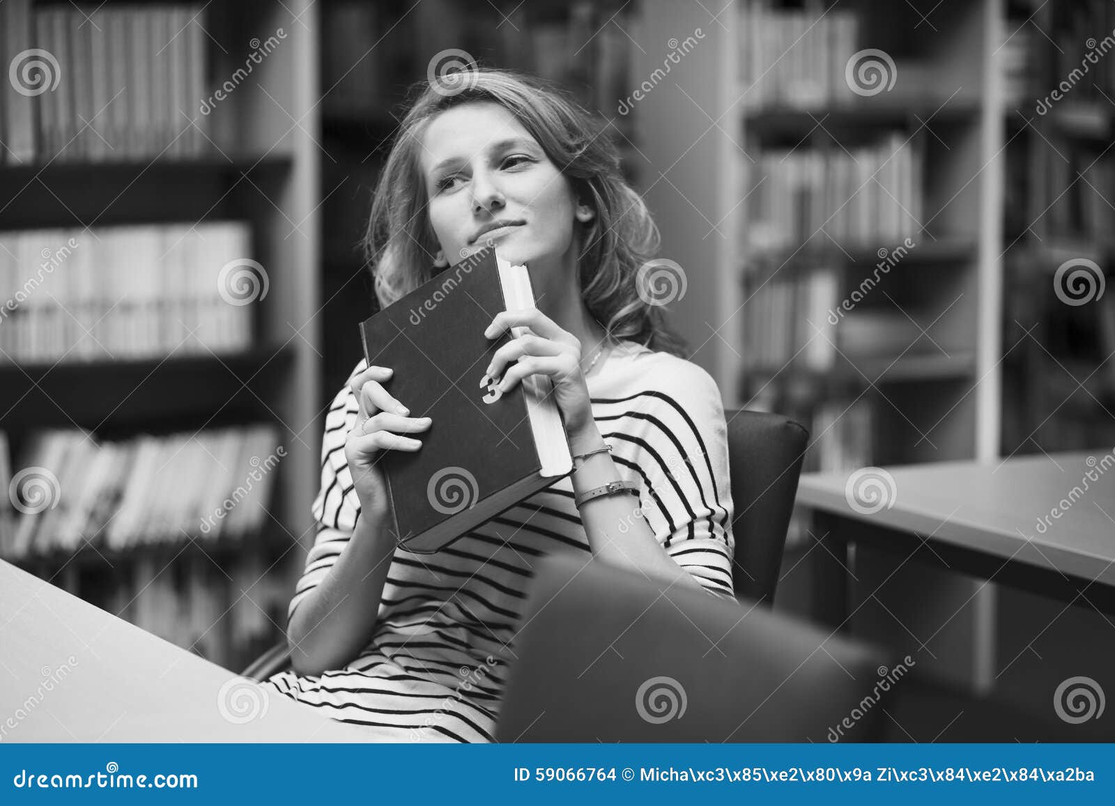 Clever Student with Open Book Reading it in College Library Stock Photo ...