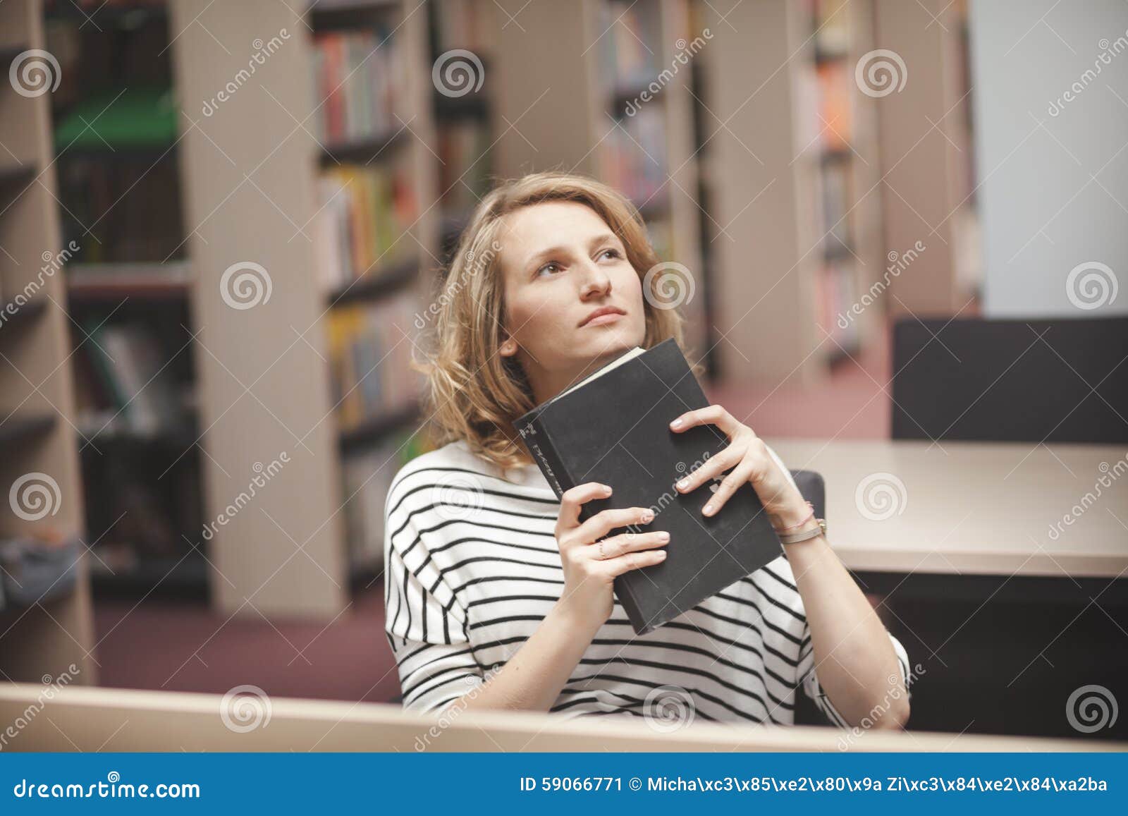 Clever Student with Open Book Reading it in College Library Stock Image ...