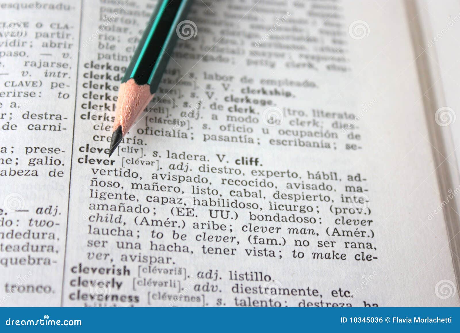 Clever Word in English-Spanish Dictionary Stock Photo - Image of text ...