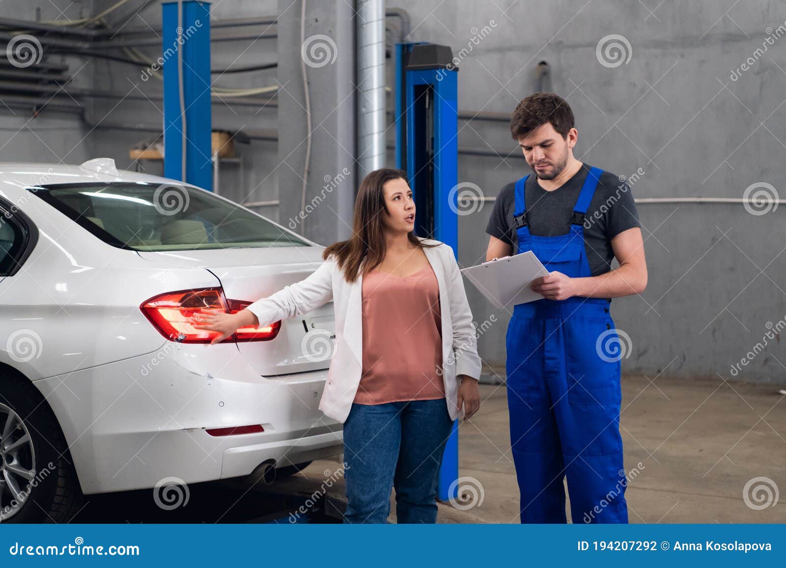 A Client Asks a Worker about a Car Repair Stock Photo - Image of order ...
