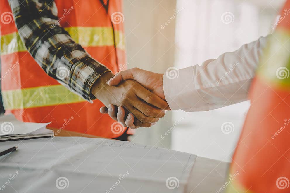 Client and Contractor. Client Shaking Hands with Team Builder in ...