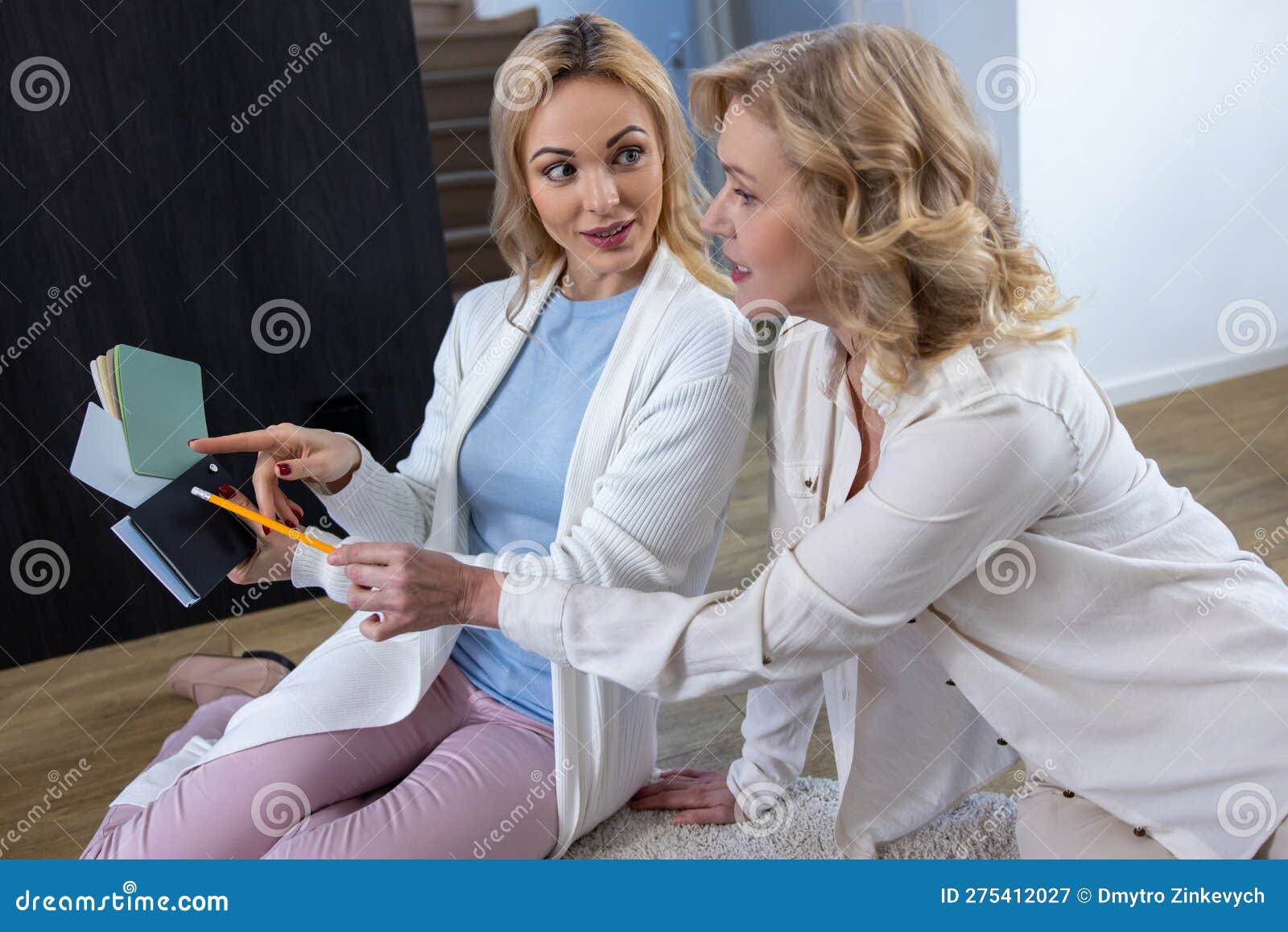 Client and an Interior Designer Choosing Materials for Home Decor Stock ...