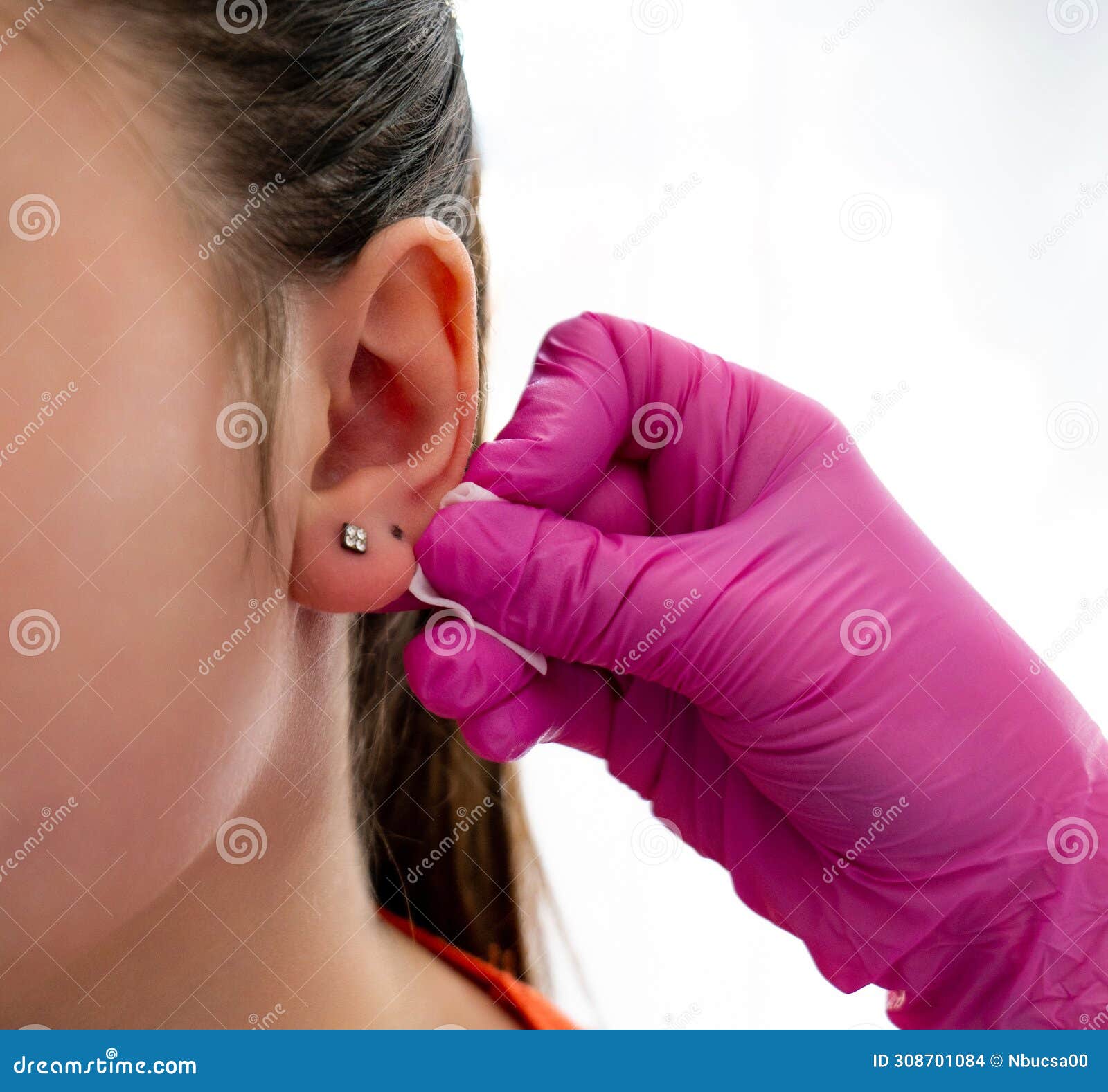 The Client& X27;s Ear Marked by the Professional Doctor through a Point ...