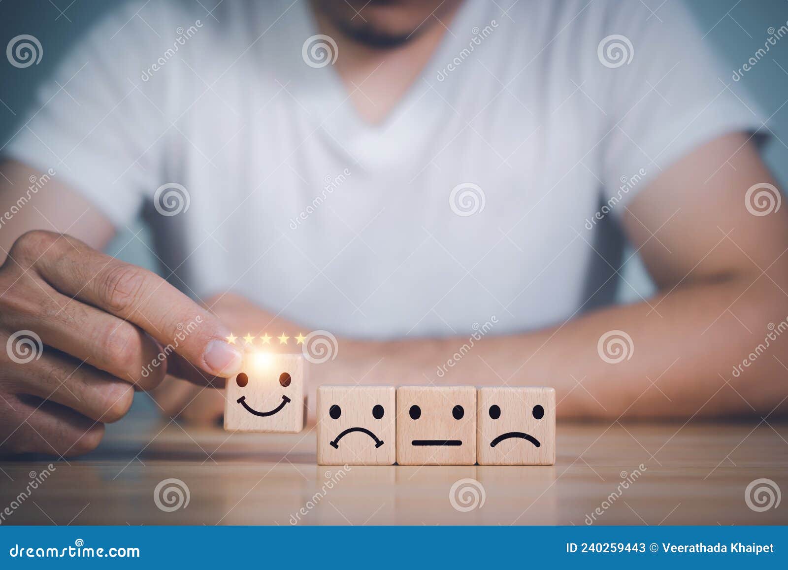 The Client`s Hand Picked the Smile Face Symbol on Wooden Blocks, the ... The Client`s Hand Picked the Smile Face Symbol on Wooden Blocks, the ...
