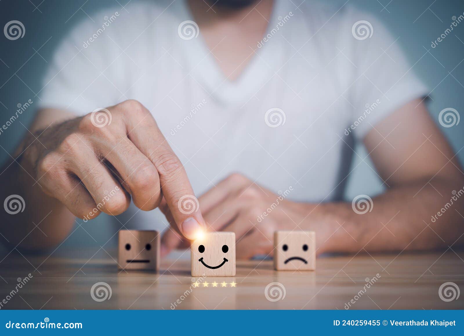 The Client`s Hand Picked the Smile Face Symbol on Wooden Blocks, the ... The Client`s Hand Picked the Smile Face Symbol on Wooden Blocks, the ...