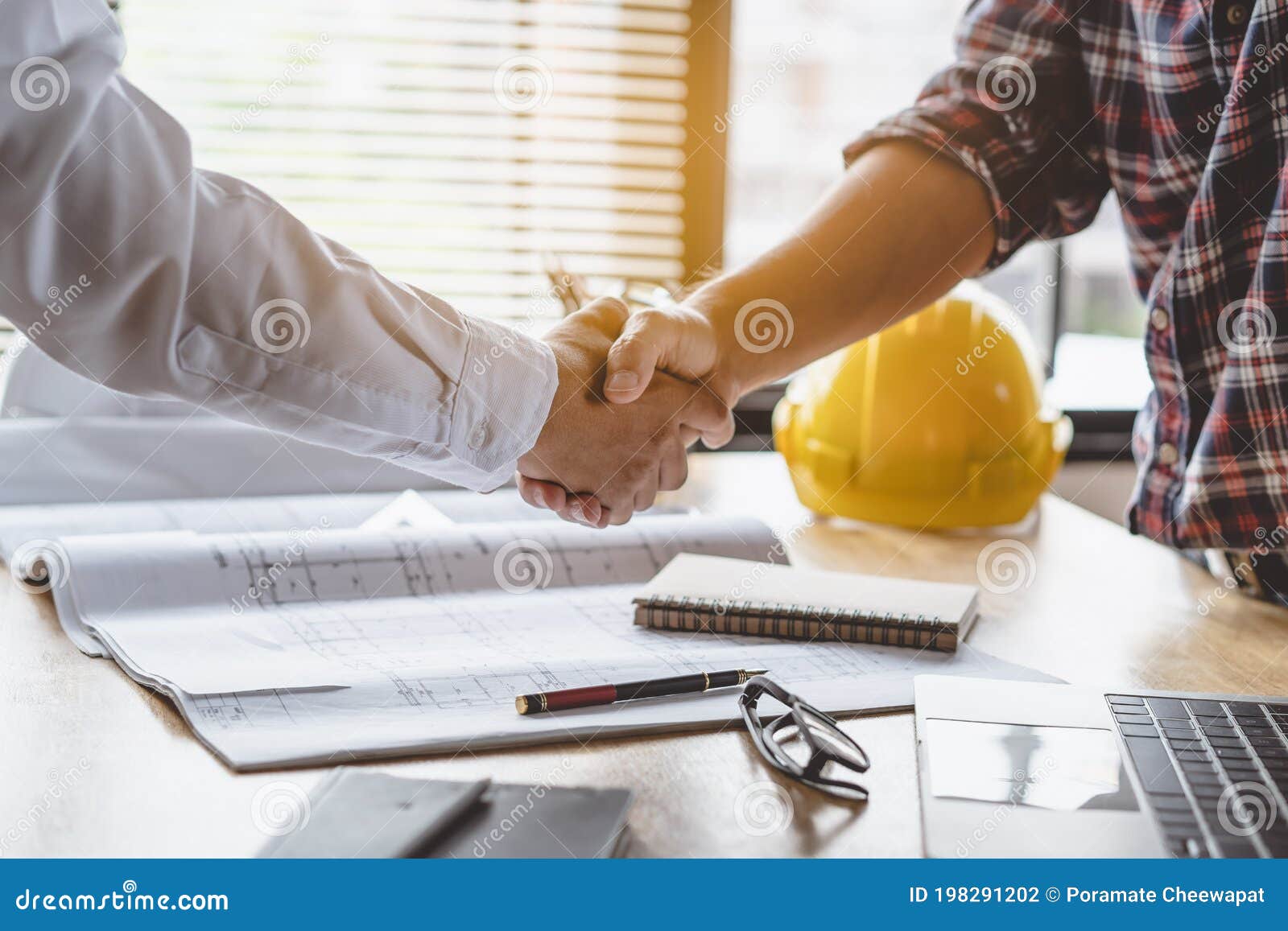 Client Shaking Hands With Contractor After Confirm Blueprint To ...