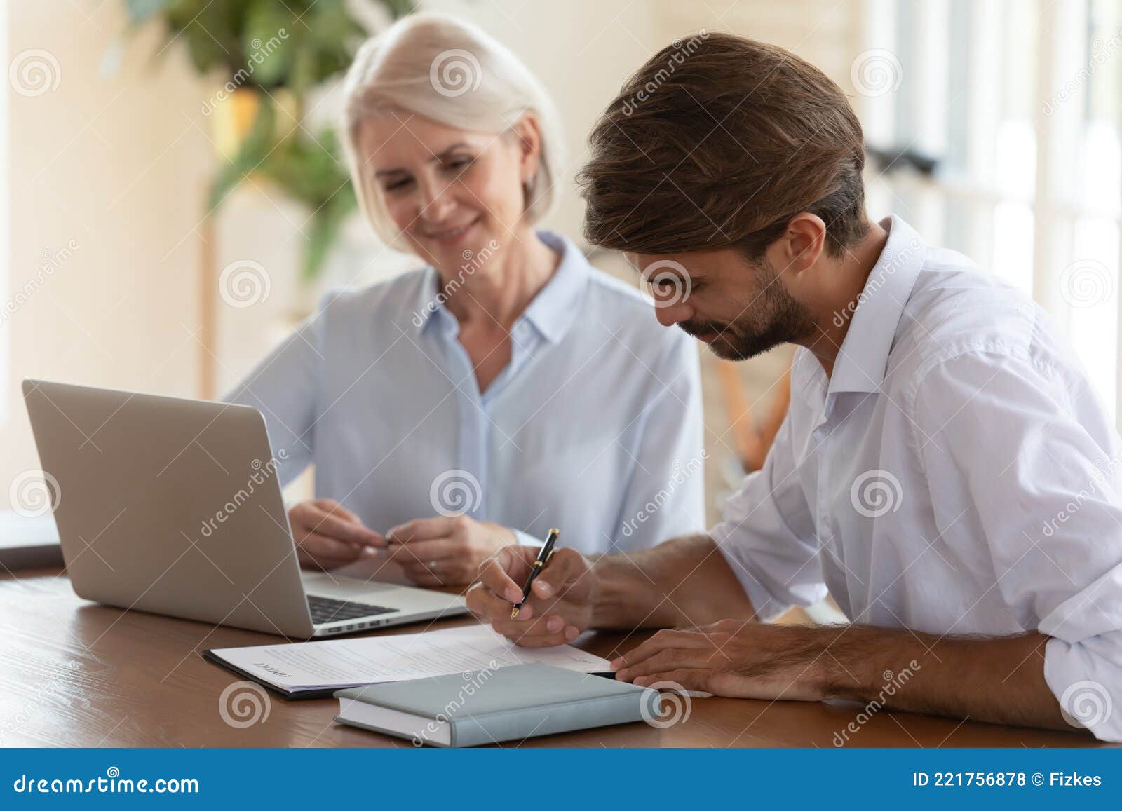 Client Signing Contract with Middle Aged Manager after Successful ... Client Signing Contract with Middle Aged Manager after Successful ...