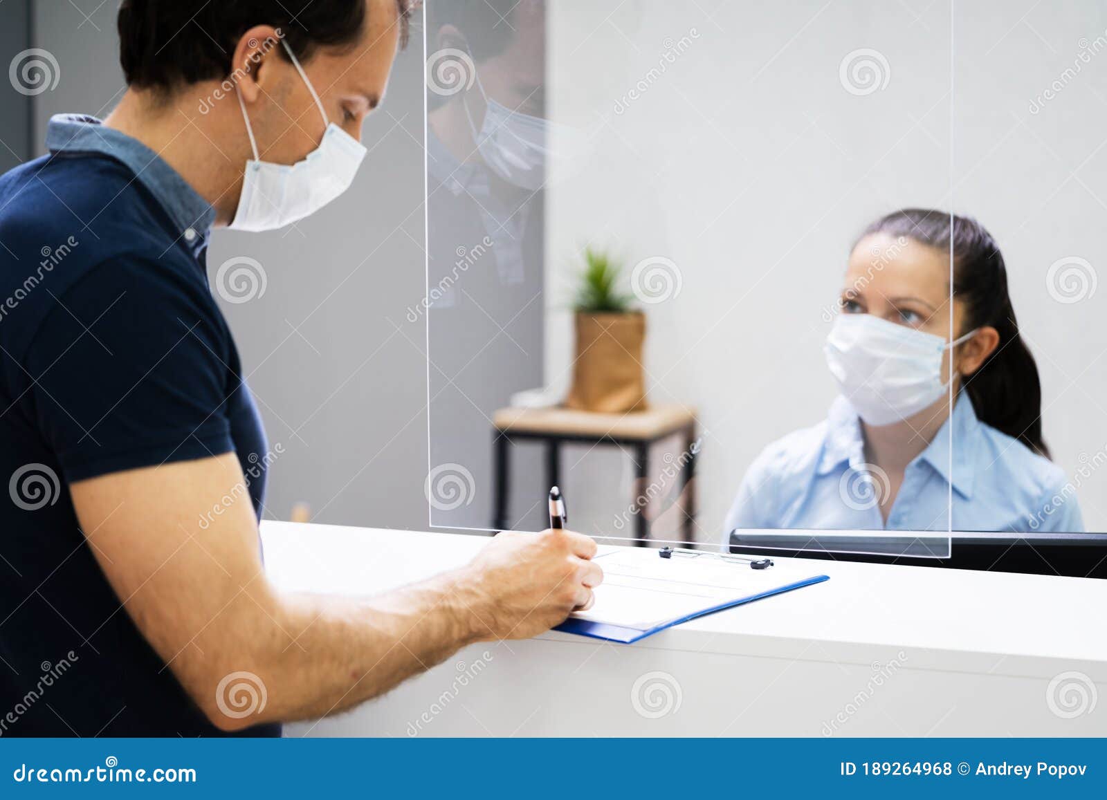 Client Signing Paper at Reception Desk Stock Photo - Image of reader ...