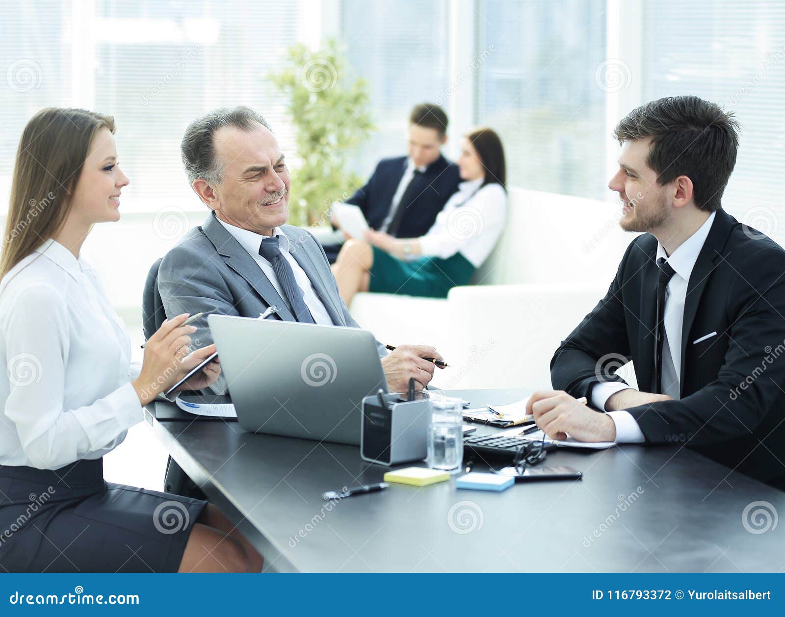 Client Talking with the Staff at the Desk in the Office Stock Photo ...