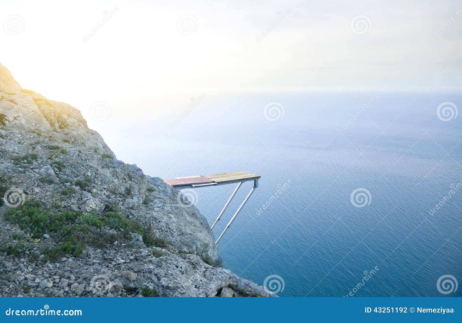 Cliff into Blue Water stock photo. Image of silhouette - 43251192