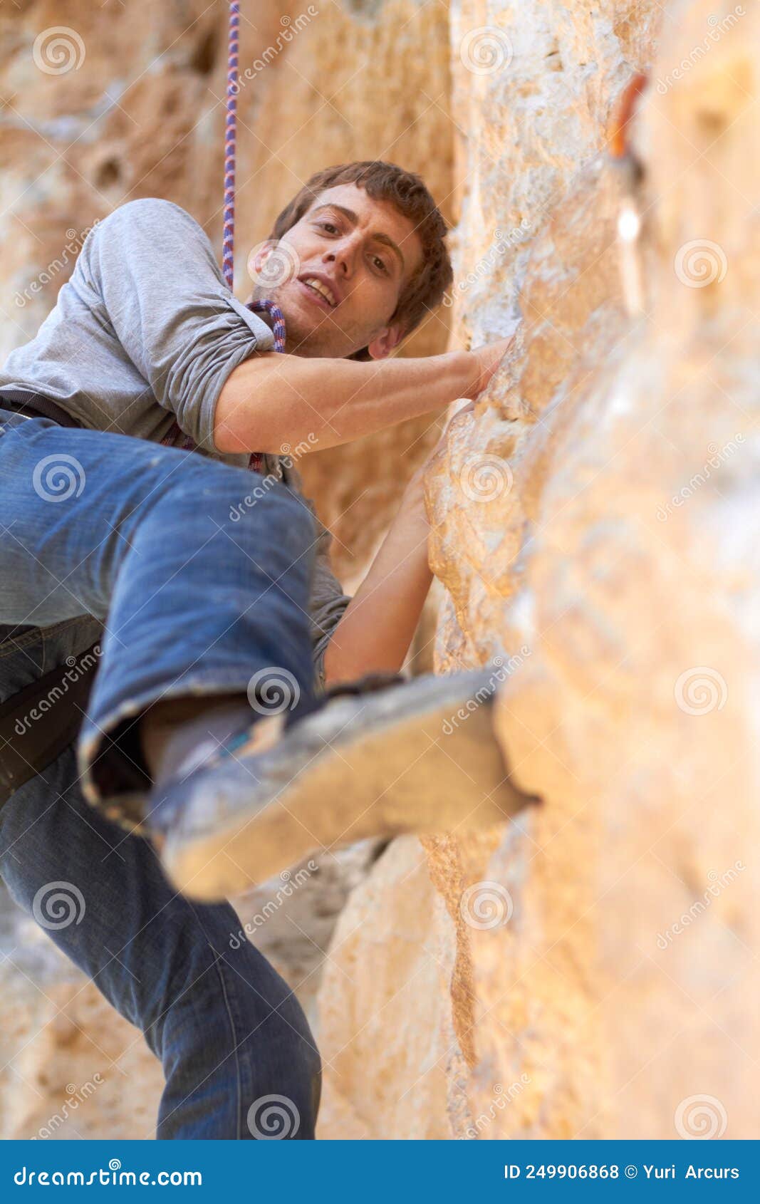 Cliff Climber. Portrait of a Young Rock Climber on a Climbing Rockface ...