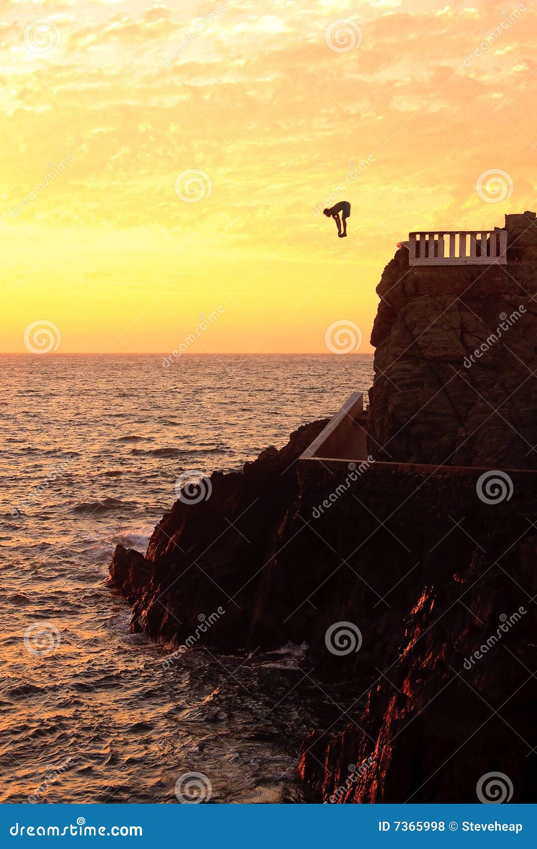 Cliff Diver Off the Coast of Mazatlan at Sunset Stock Photo - Image of ...