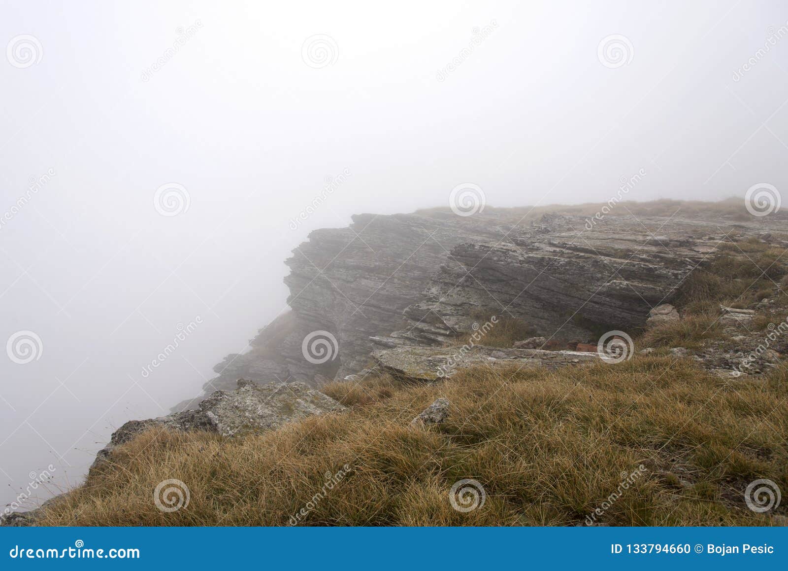 Cliff on the Mountain in the Fog Stock Photo - Image of mountains ...