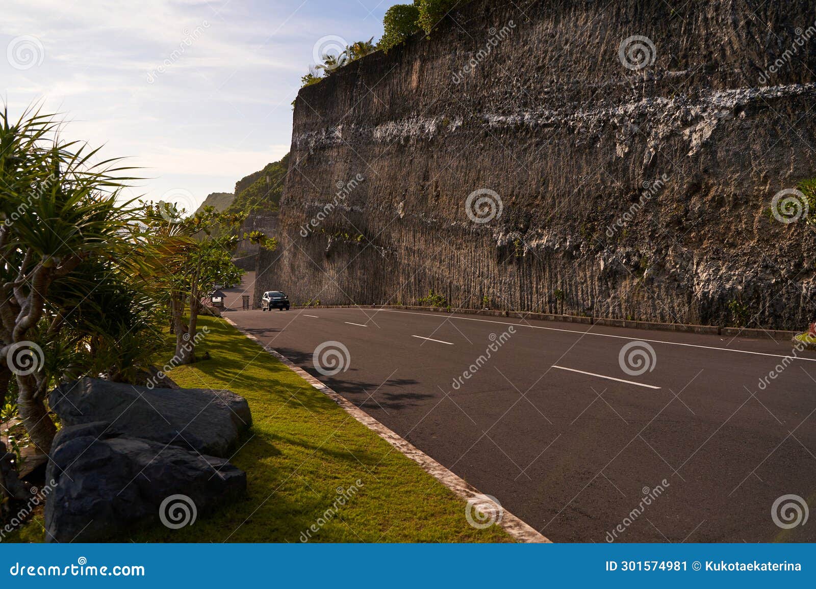 The Cliff Overhangs Along the Road To the Ocean at Sunset Stock Image ...