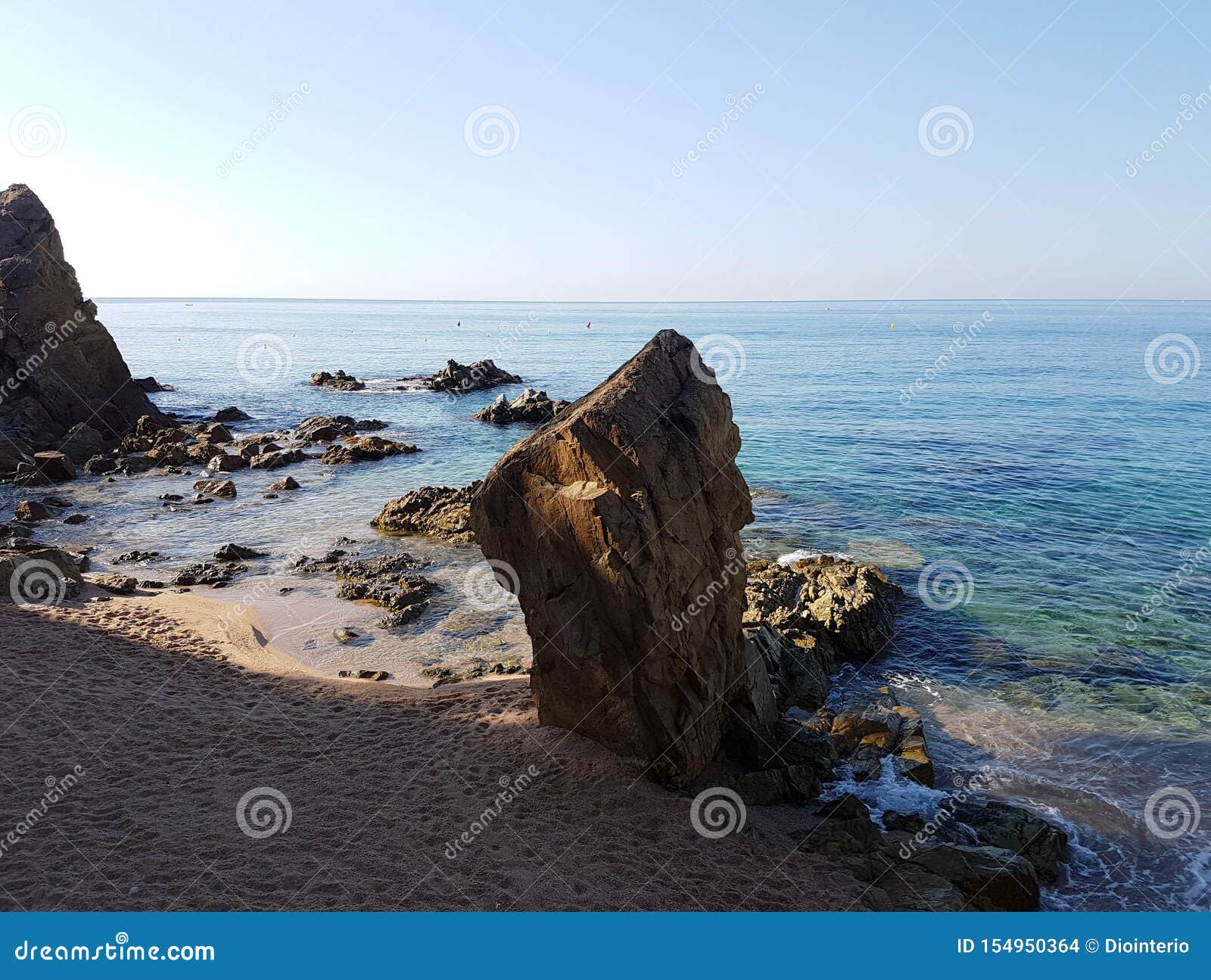 Cliff on the sandy beach stock photo. Image of clear - 154950364