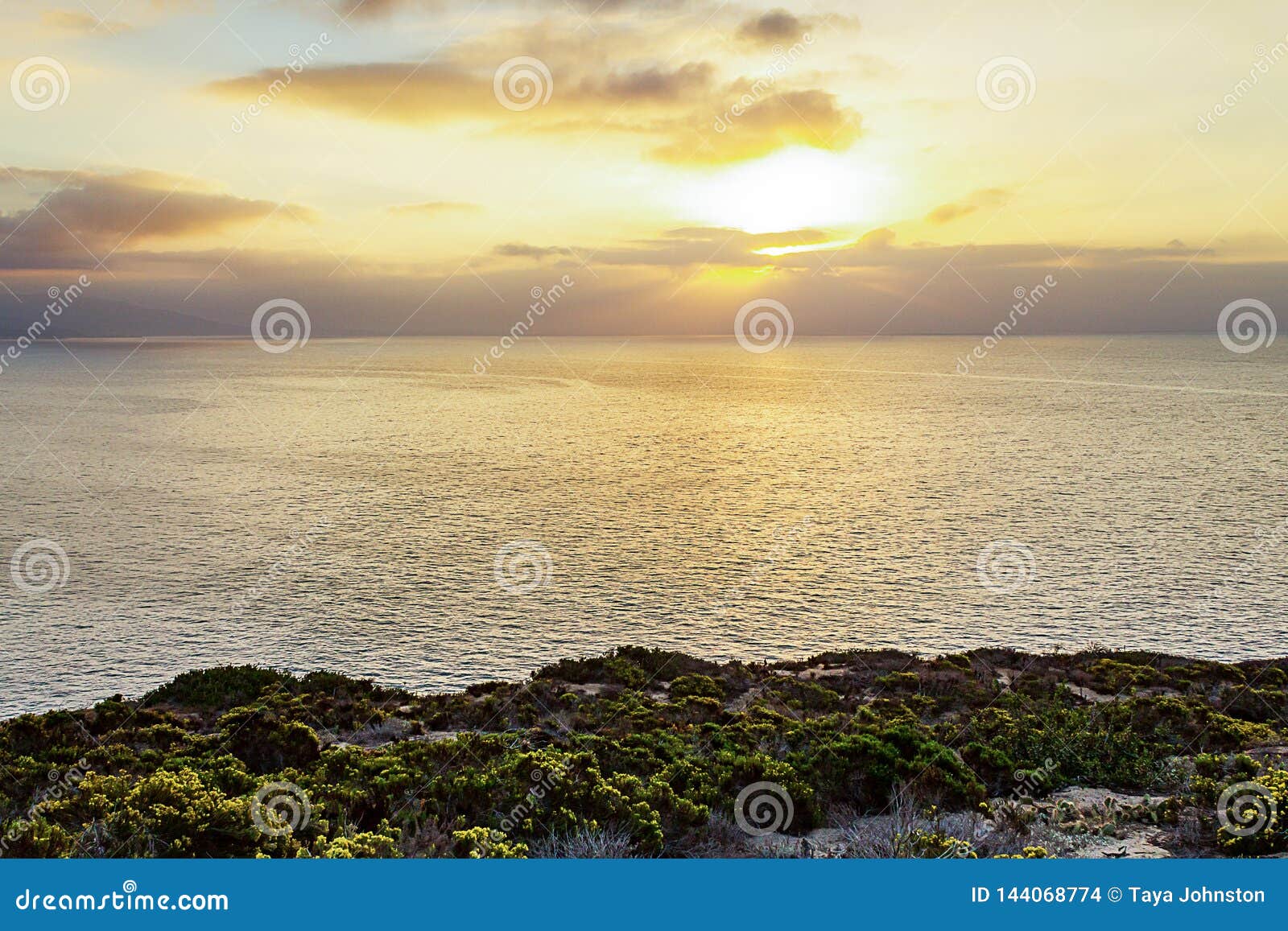 Cliff Side View of Pacific Ocean at Sunrise with Sunrays Stock Photo ...