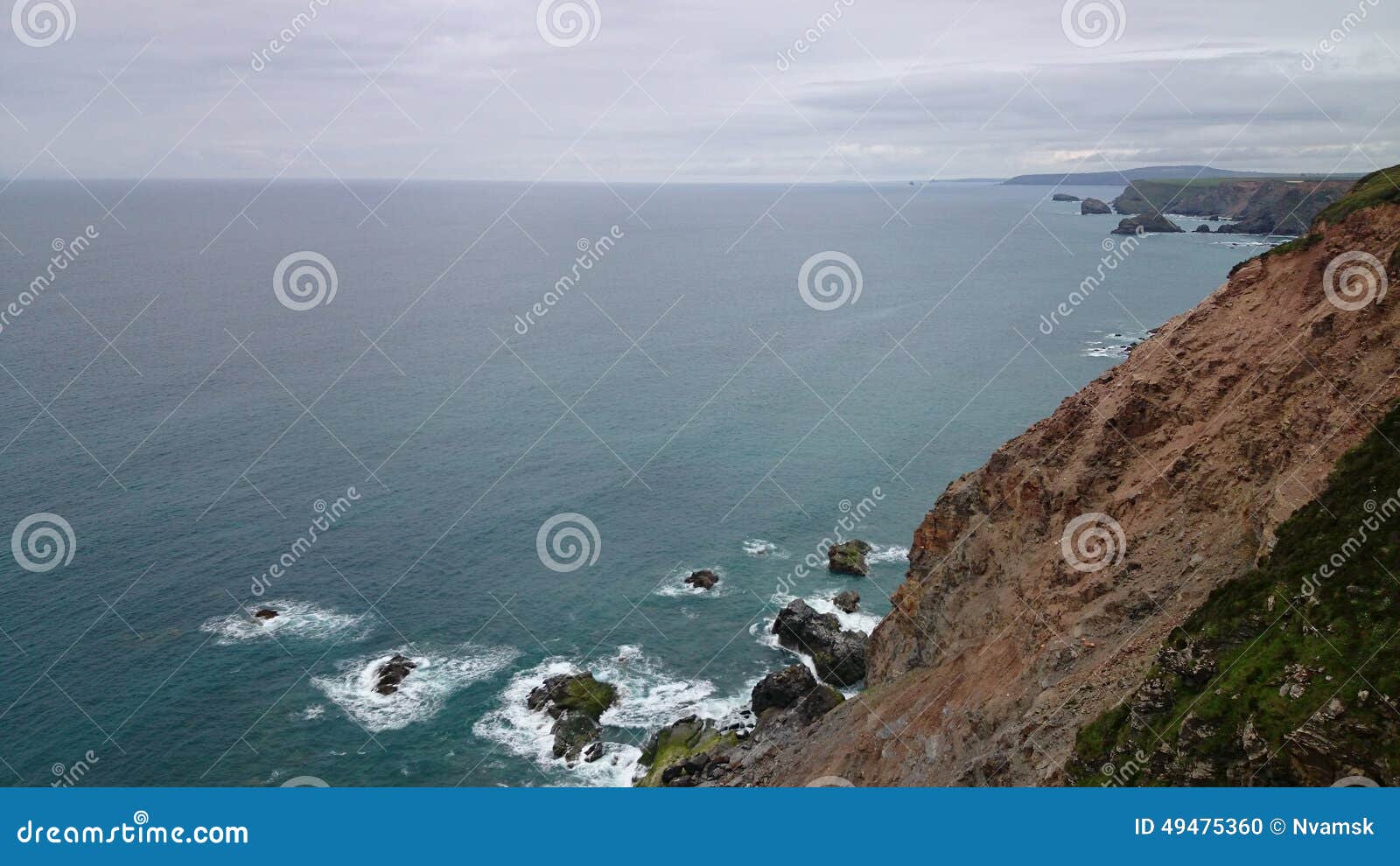Cliff slides into ocean stock photo. Image of beautiful - 49475360