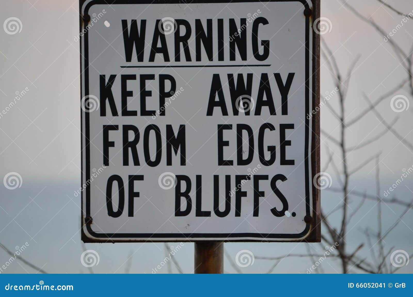 Bluff Edge Warning Sign stock image. Image of cliff, lake - 66052041