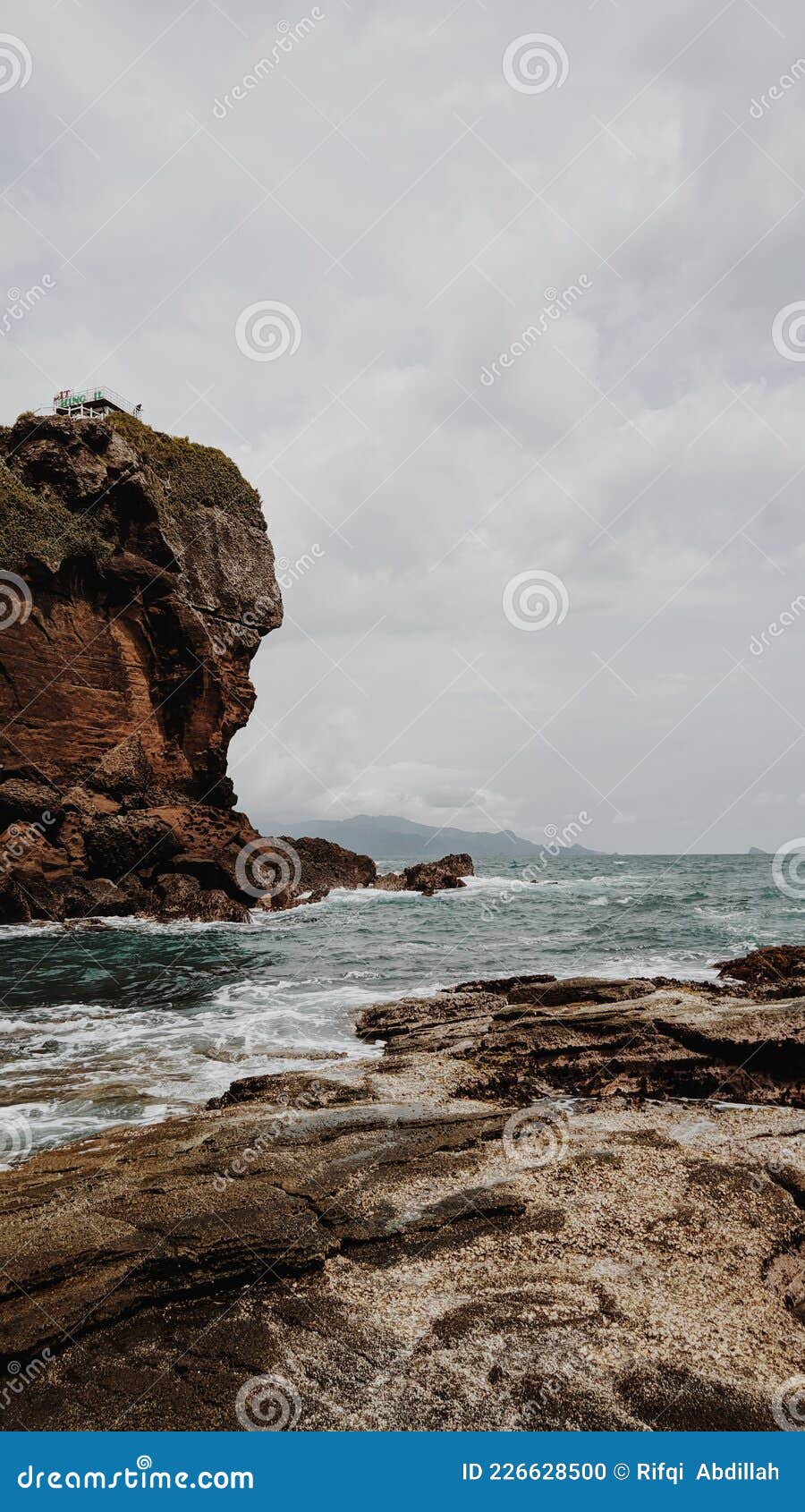 Cliffs by the beach stock photo. Image of rock, looks - 226628500