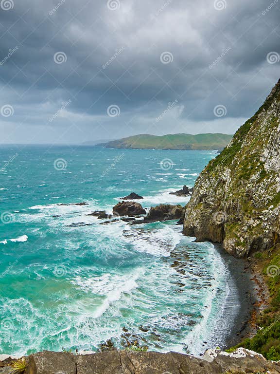 Cliffs Under Thunder Clouds and Turquoise Ocean Stock Photo - Image of ...