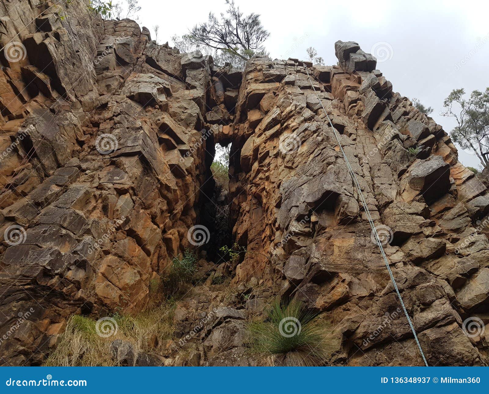 Cliffside arch stock image. Image of cliff, small, used - 136348937